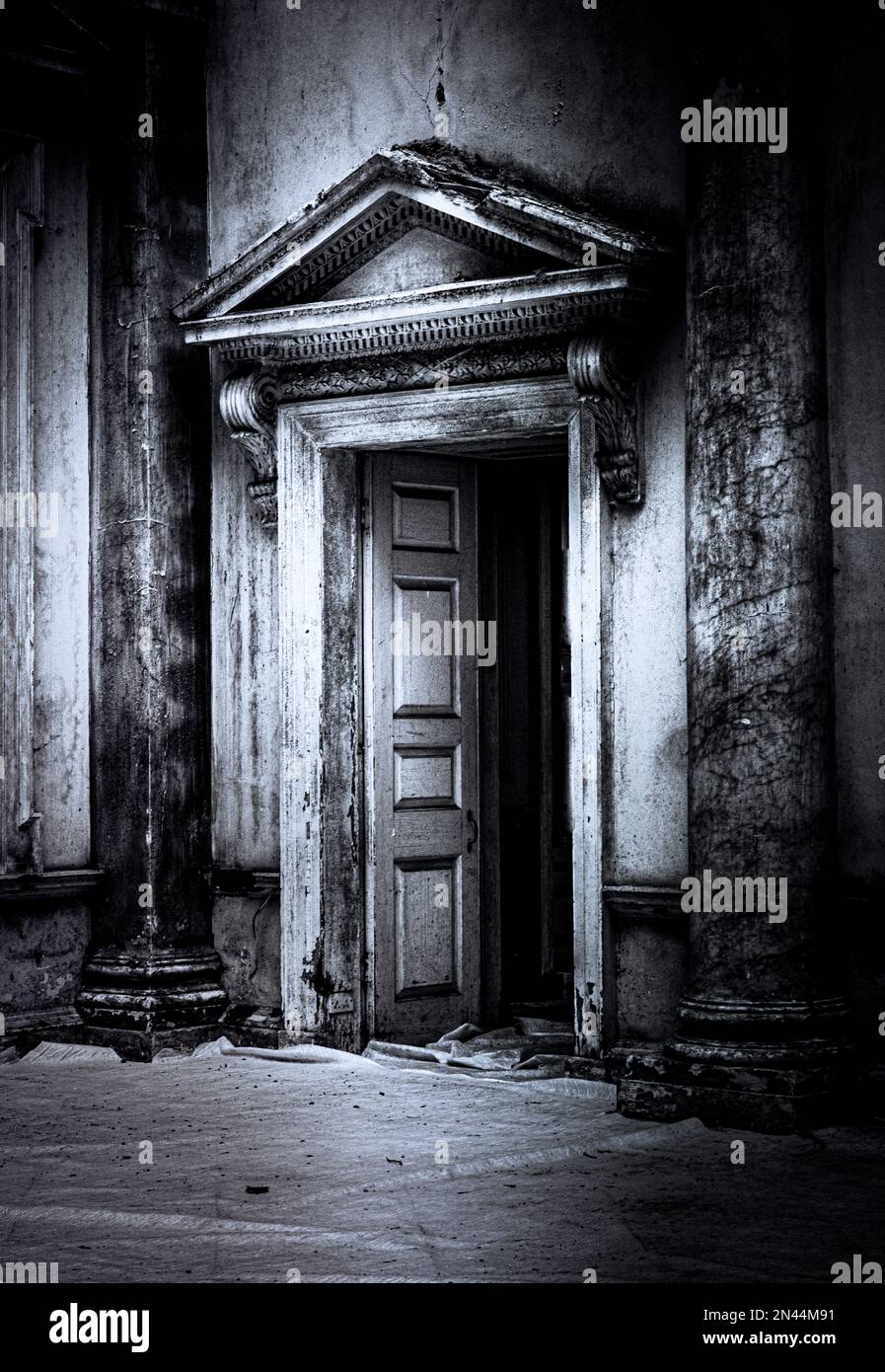 A fire damaged door in an abandoned building Stock Photo - Alamy