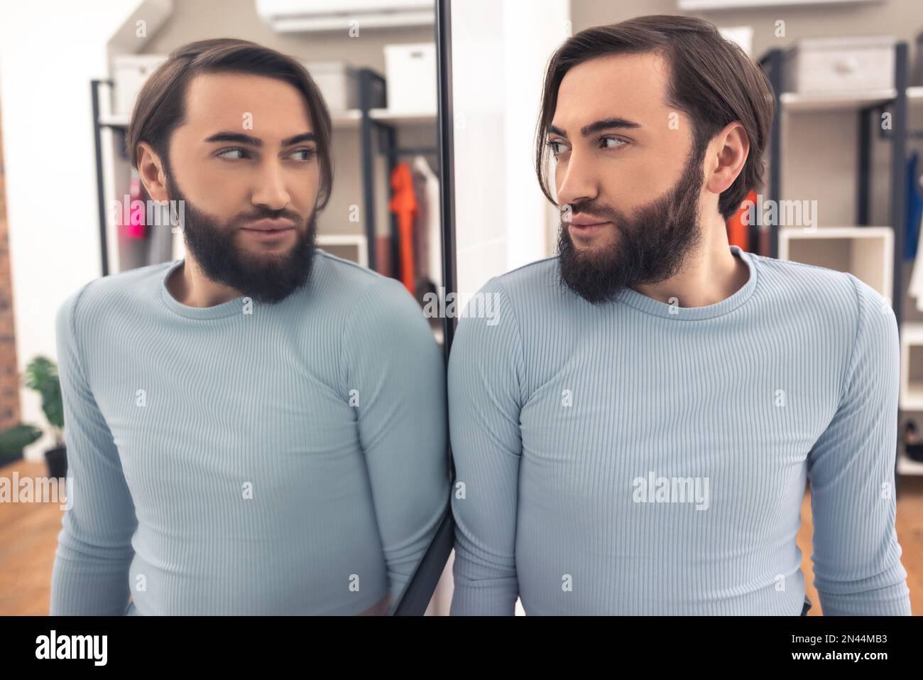 Male looking at his appearance after the makeup application Stock Photo ...