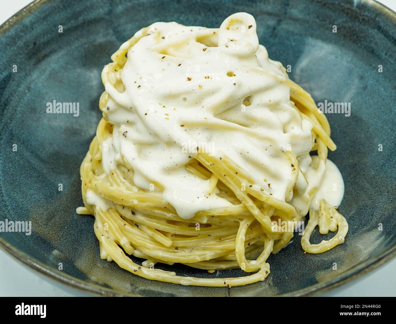 Spaghetti with four cheese sauce Italian style in a restaurant Stock ...