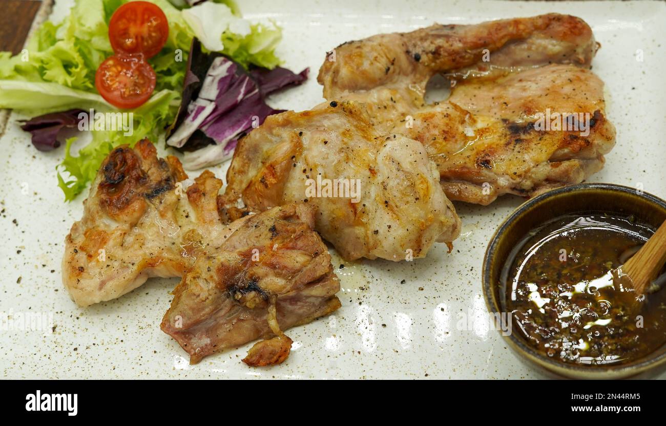 Grilled farm chicken in Mediterranean restaurant Stock Photo - Alamy