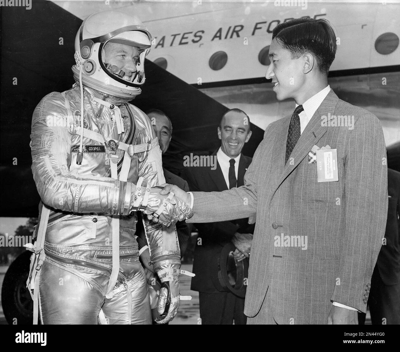 Crown Prince Akihito of Japan shakes hands with Air Force Capt. L ...