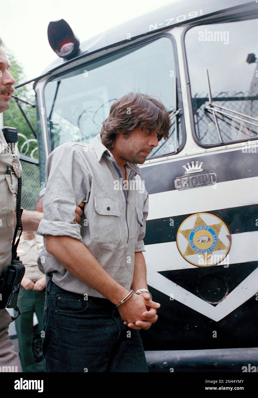 Christian Brando, 32, son of actor Marlon Brando, is escorted off a bus ...