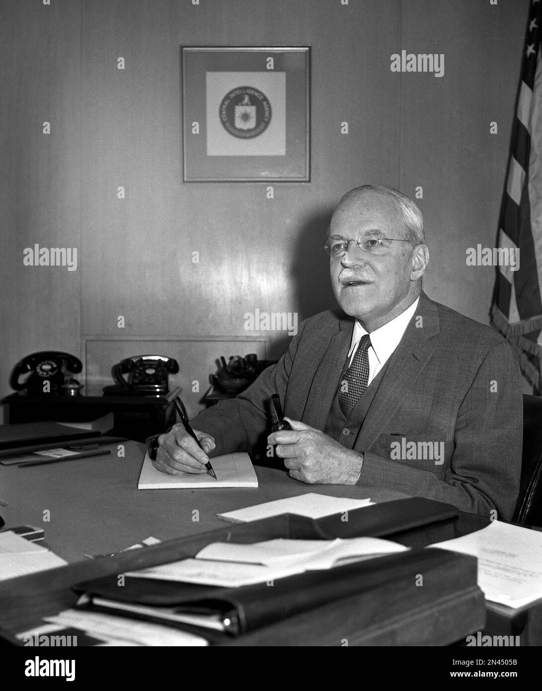 Allen W. Dulles, director of the Central Intelligence Agency, poses in ...