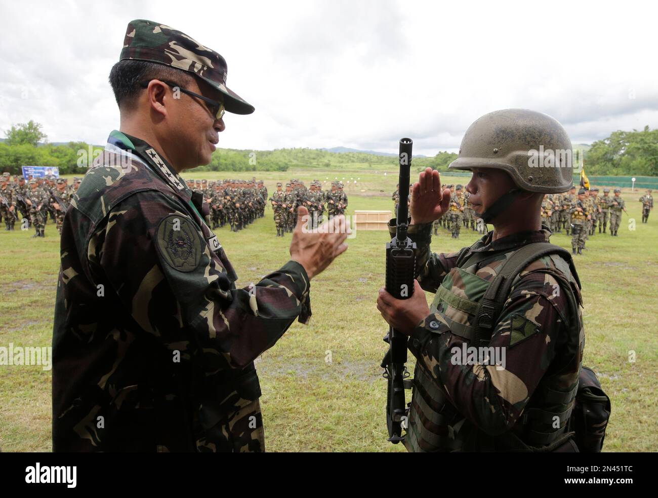 Philippine Armed Forces Chief Gen. Gregorio Pio Catapang, left, hands ...