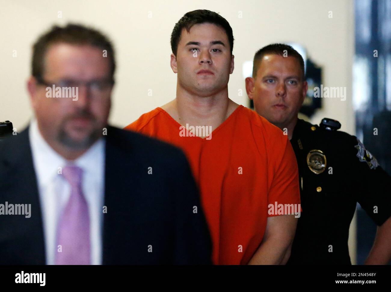 Daniel Holtzclaw, center, an Oklahoma City police officer accused of ...