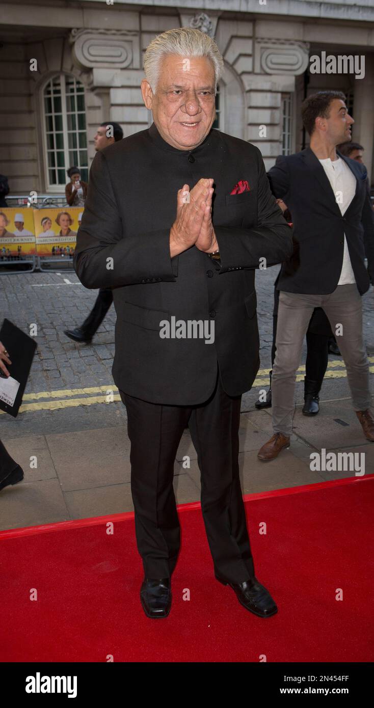 British actor Om Puri poses for photographers as he arrives for the UK ...