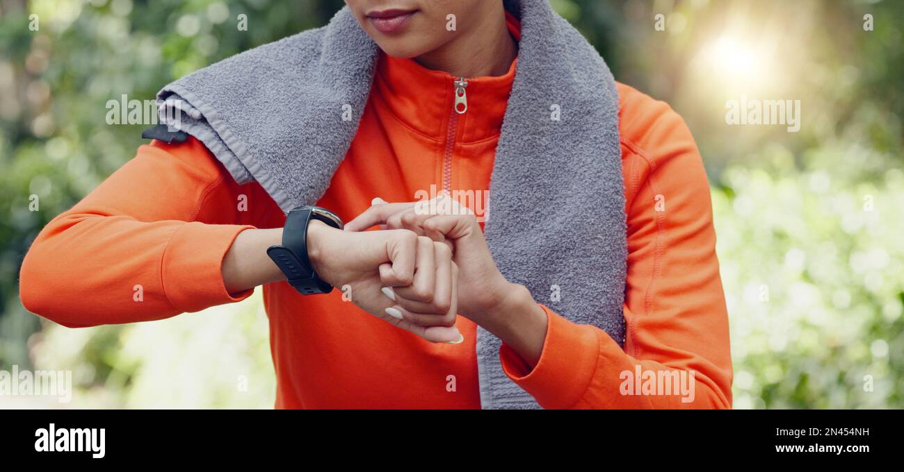 Woman fitness athlete check pulse with smartwatch while training for ...