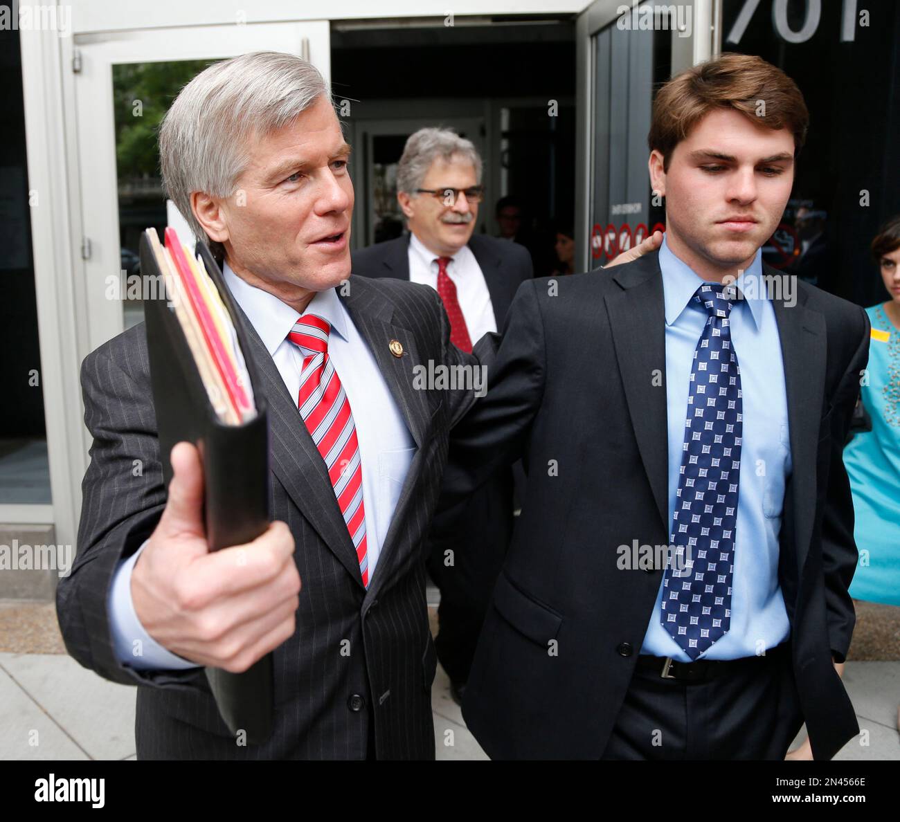 Former Virginia Gov. Bob McDonnell, left, leaves Federal Court with his ...