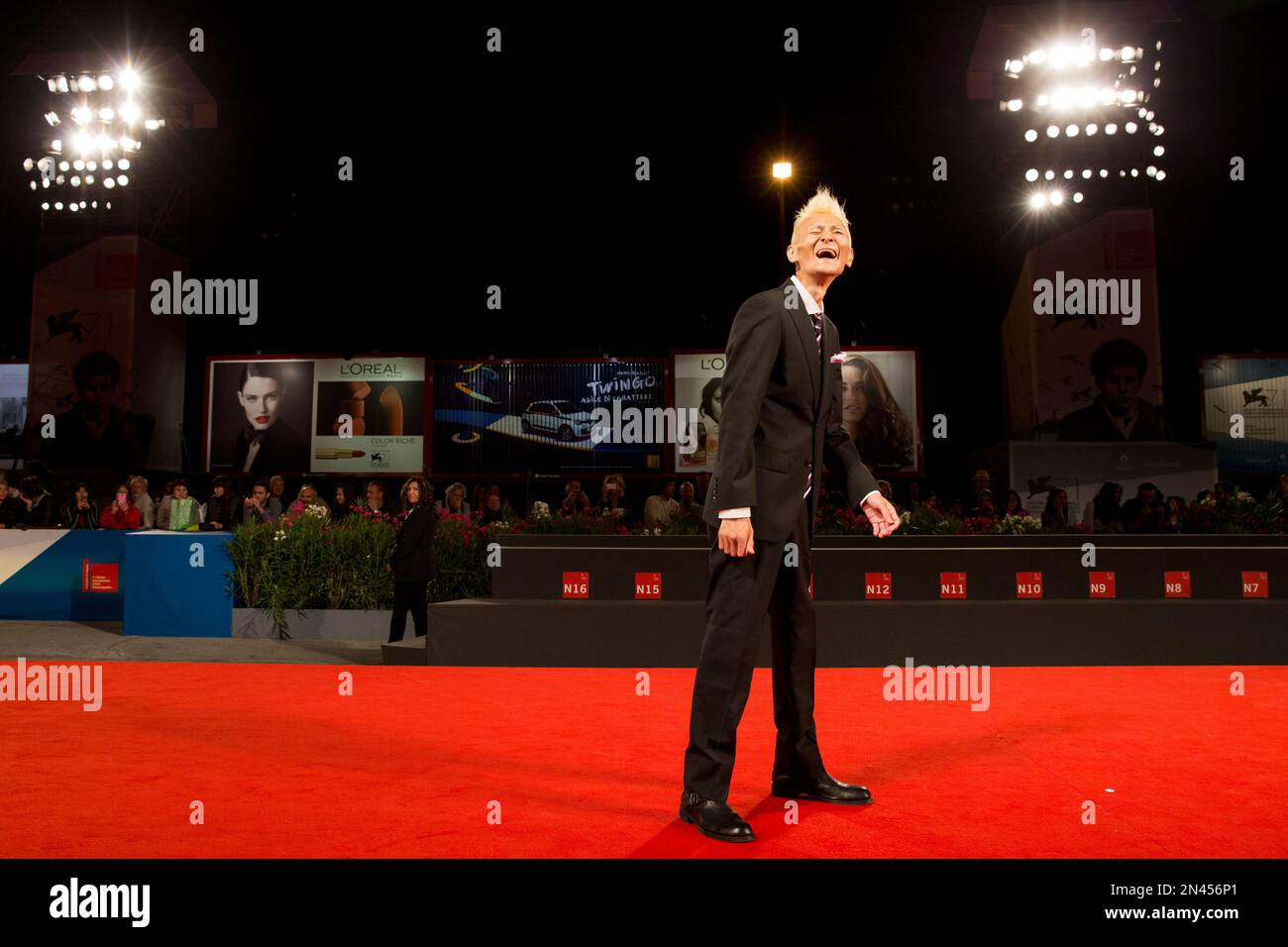 Composer Chu Ishikawa poses for photographers as he arrives for the ...