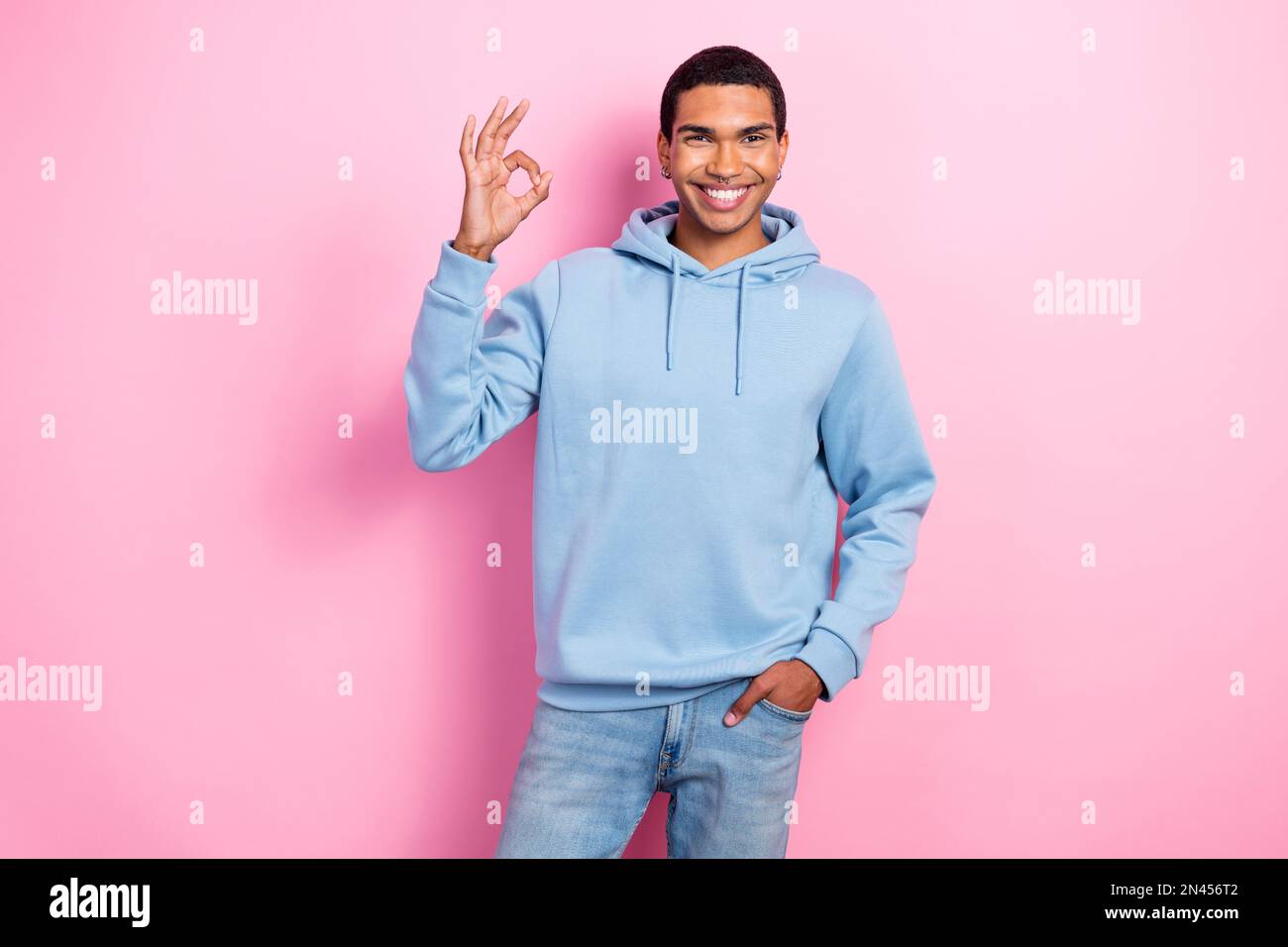 Photo of cheerful person toothy smile arm fingers demonstrate okey ...