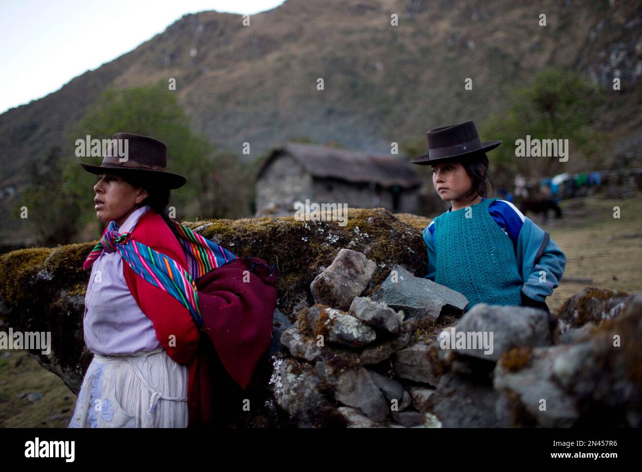 Norma Calderon, left, and her daughter Emily, 10, gather outside her ...