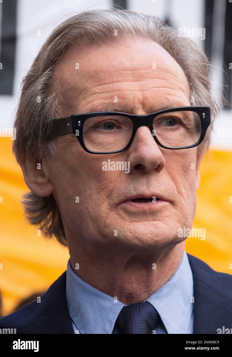 British actor Bill Nighy, centre, walks through the the crowds in the ...