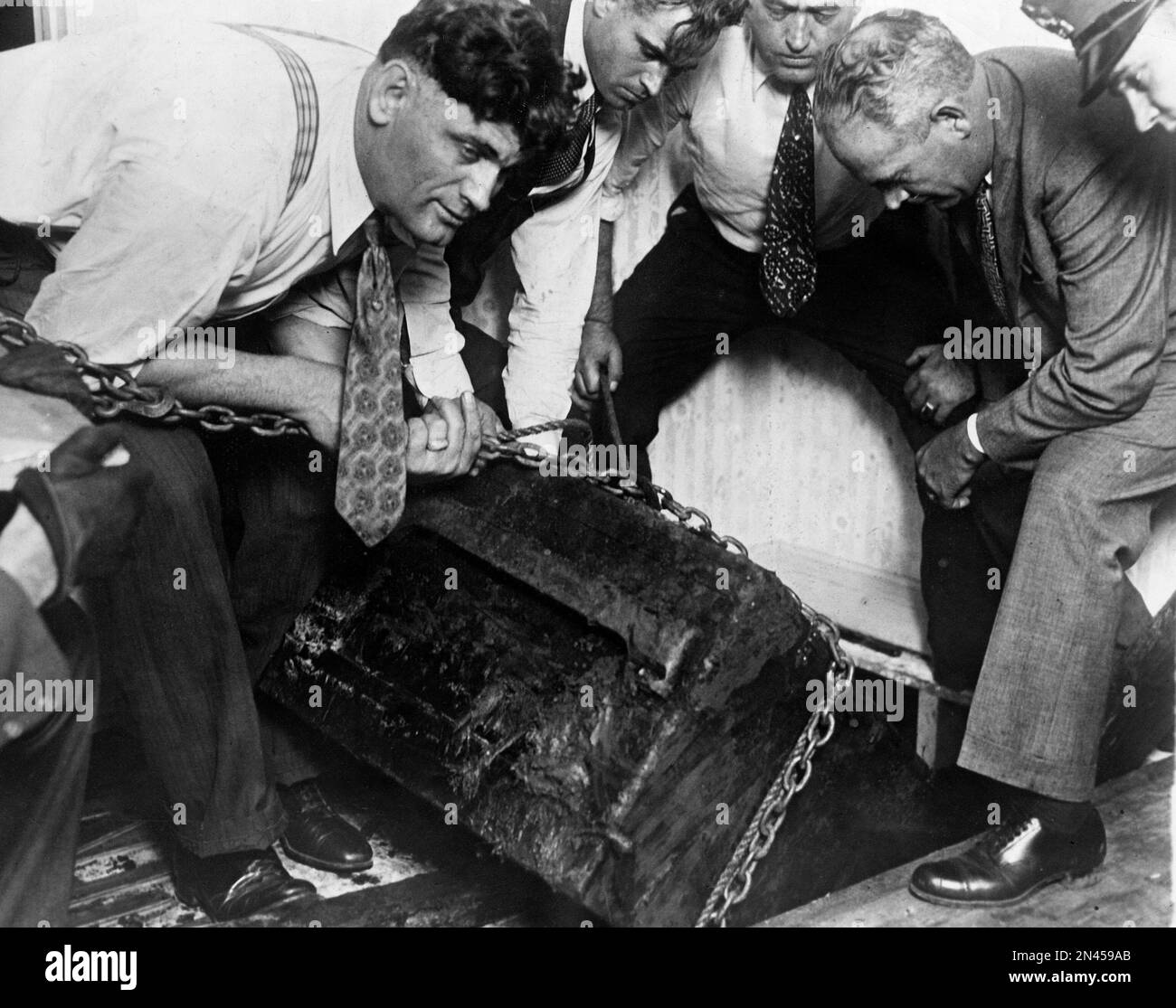 The casket of Willa Rhoads is removed by police from the shallow grave ...