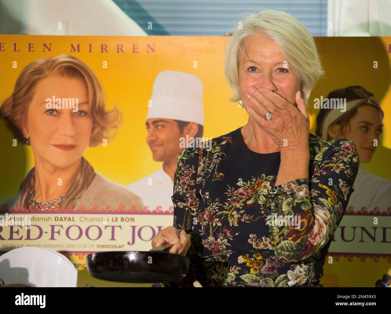British actress e Helen Mirren reacts after dropping the food from a ...