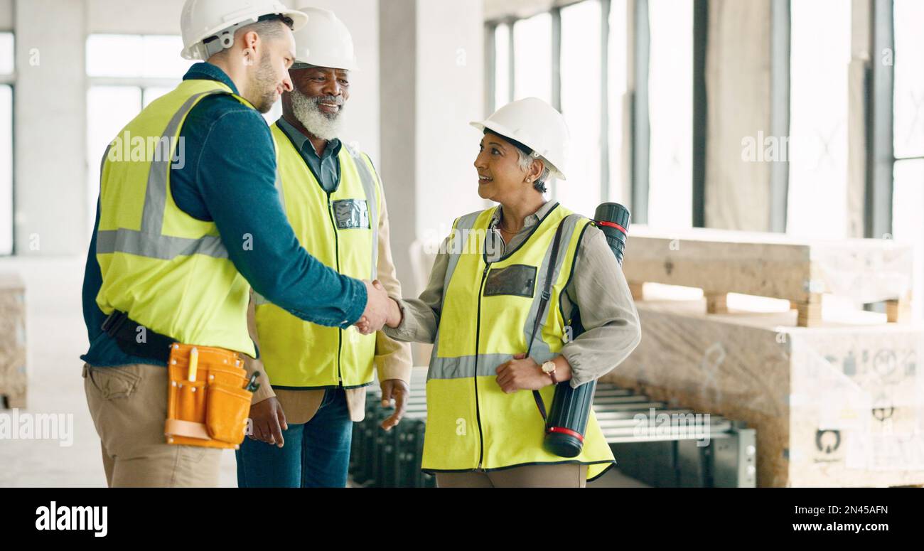 Handshake, architecture and engineering team shaking hands with a ...