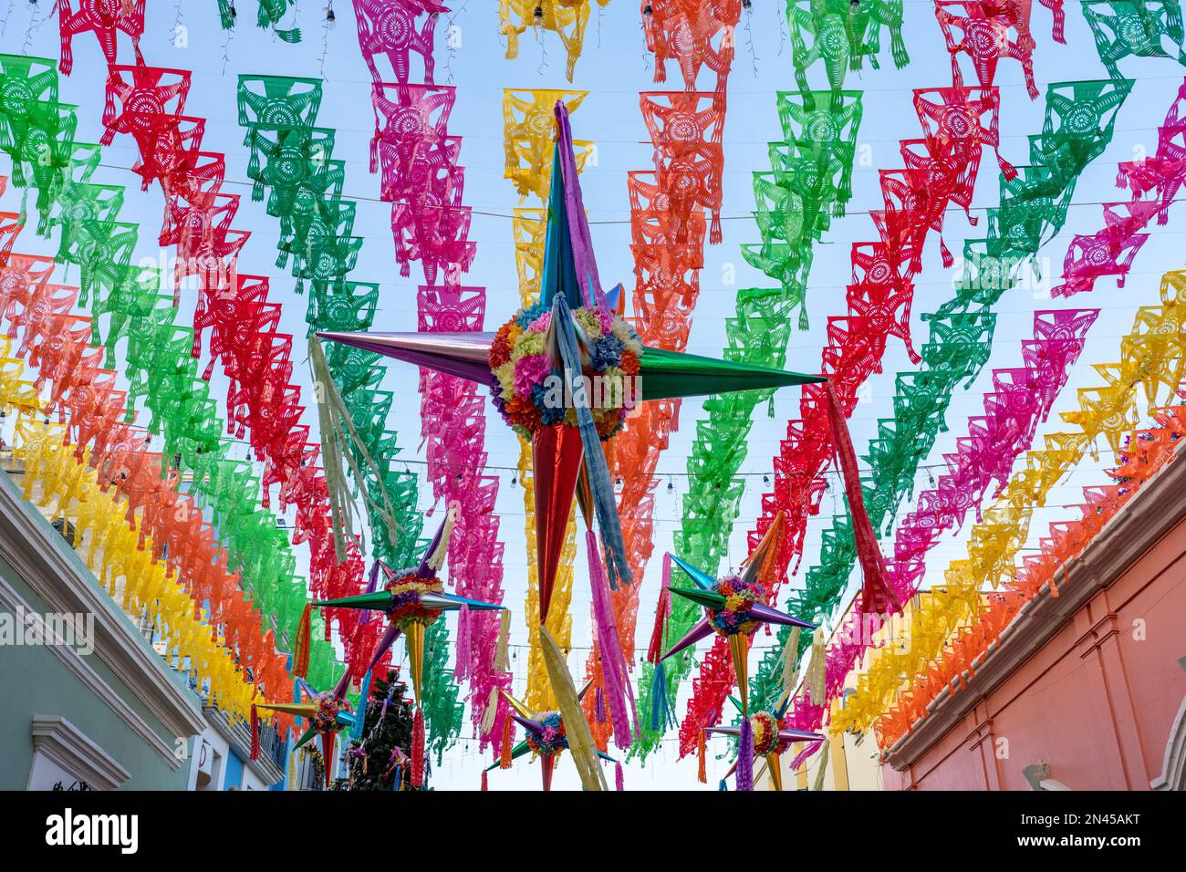Star-shaped Christmas piñatas and banners decorate Calle Macedonio ...