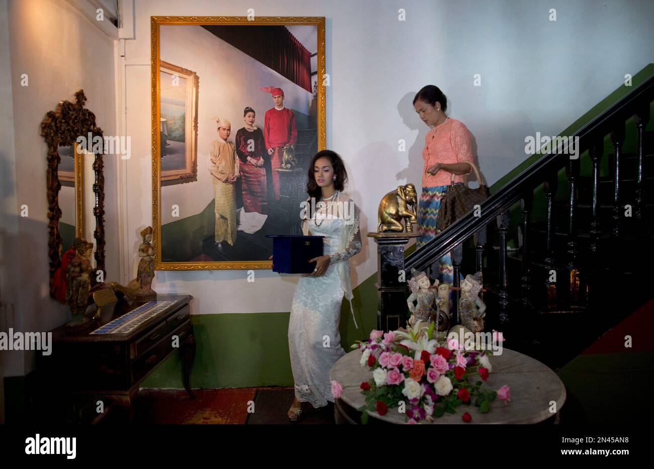 May Myat Noe, left, Myanmar's first international beauty queen, winner of the 2014 Miss Asia ...