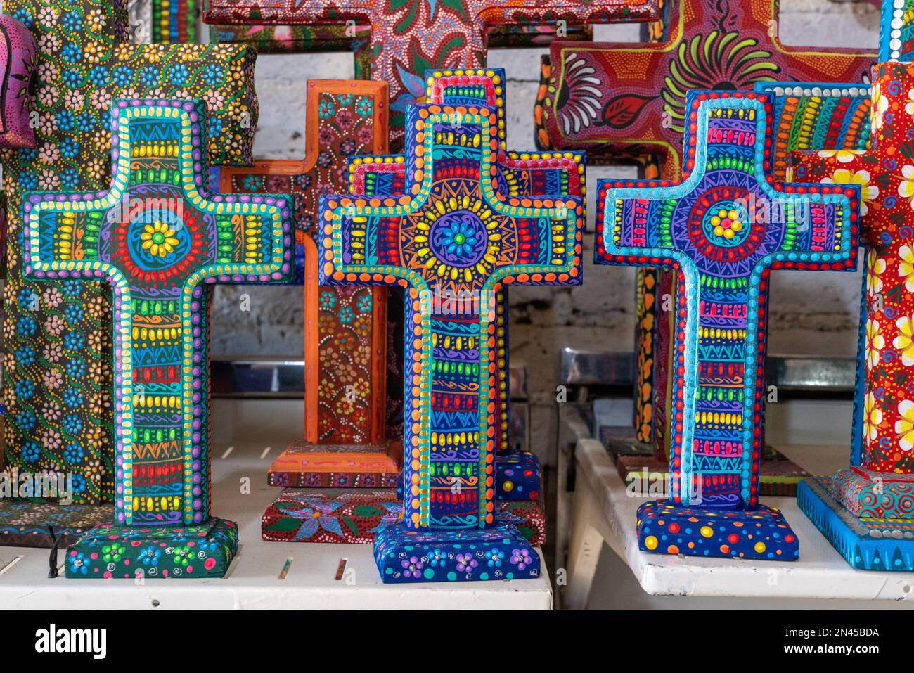 Crosses painted in alebrije style in an artisan's shop / workshop in ...