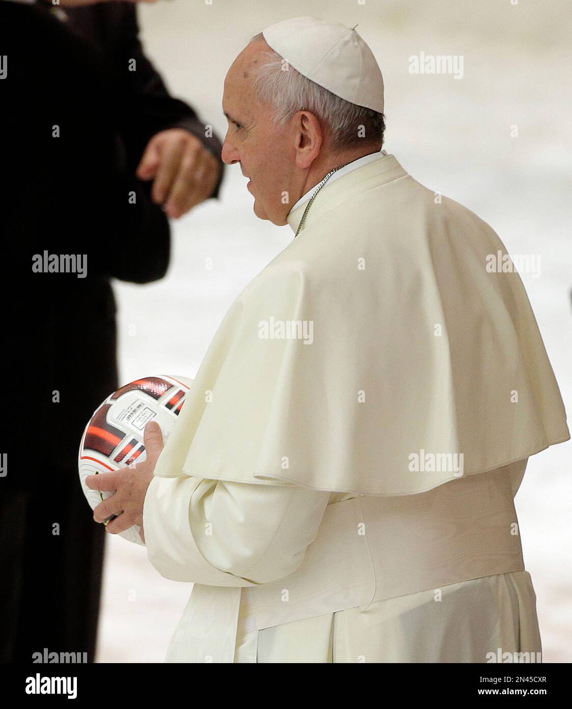 Pope Francis holds a soocer ball in the Paul VI hall at the Vatican ...