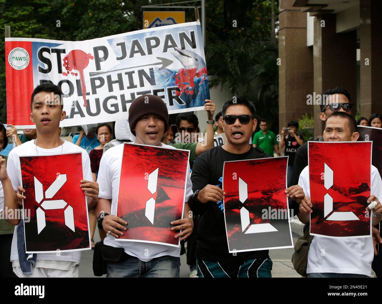Environmental activists shout slogans as they form the phrase "Stop The ...