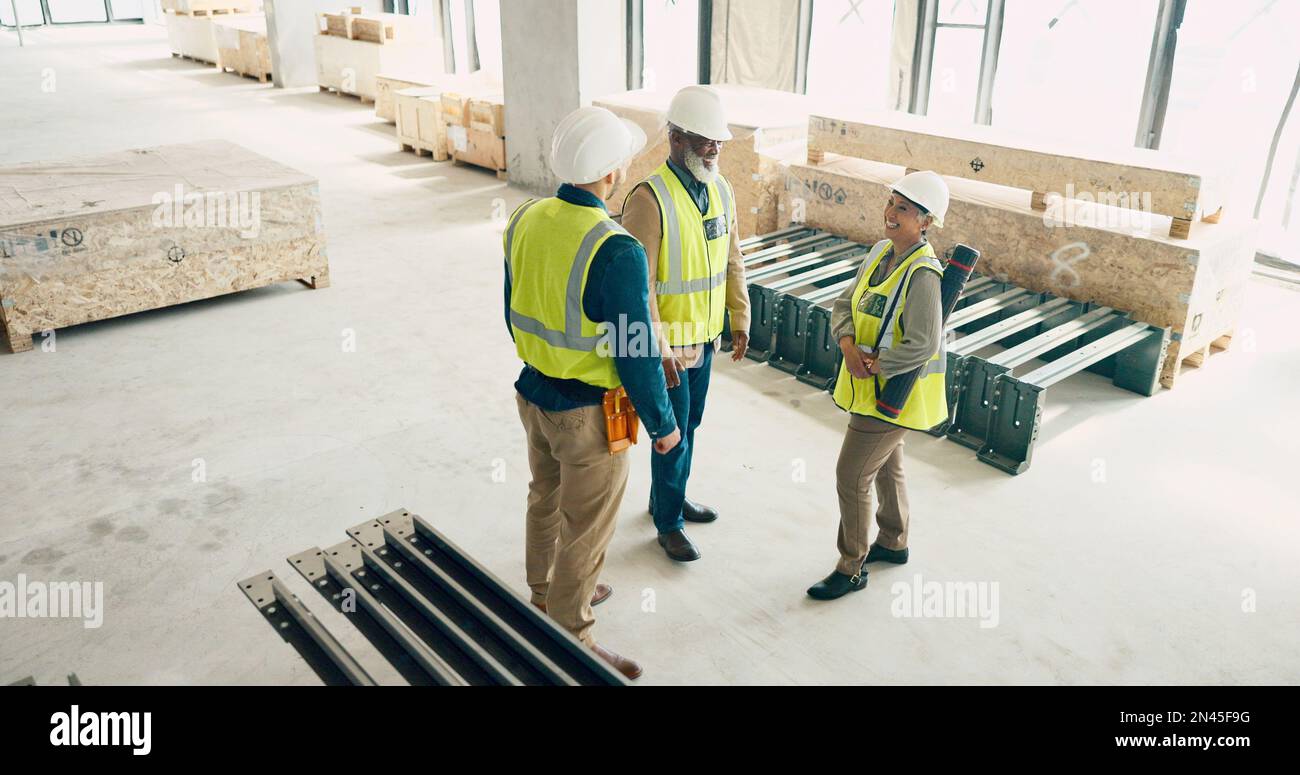 Engineering team, handshake and teamwork at construction site, support ...