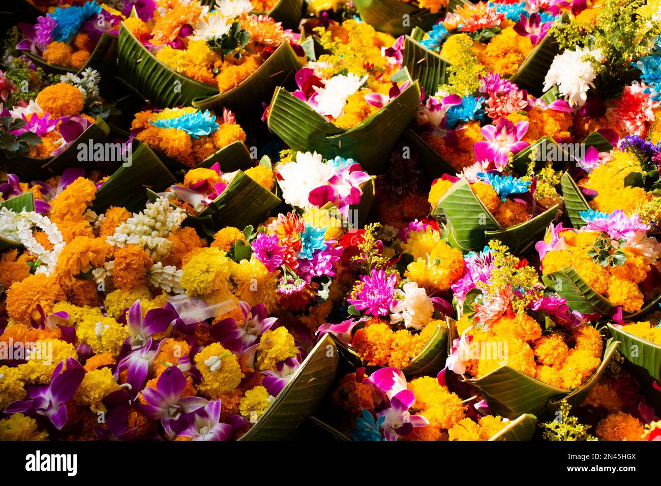 Sacrificial offering flowers floral set in banana leaf basket for thai ...