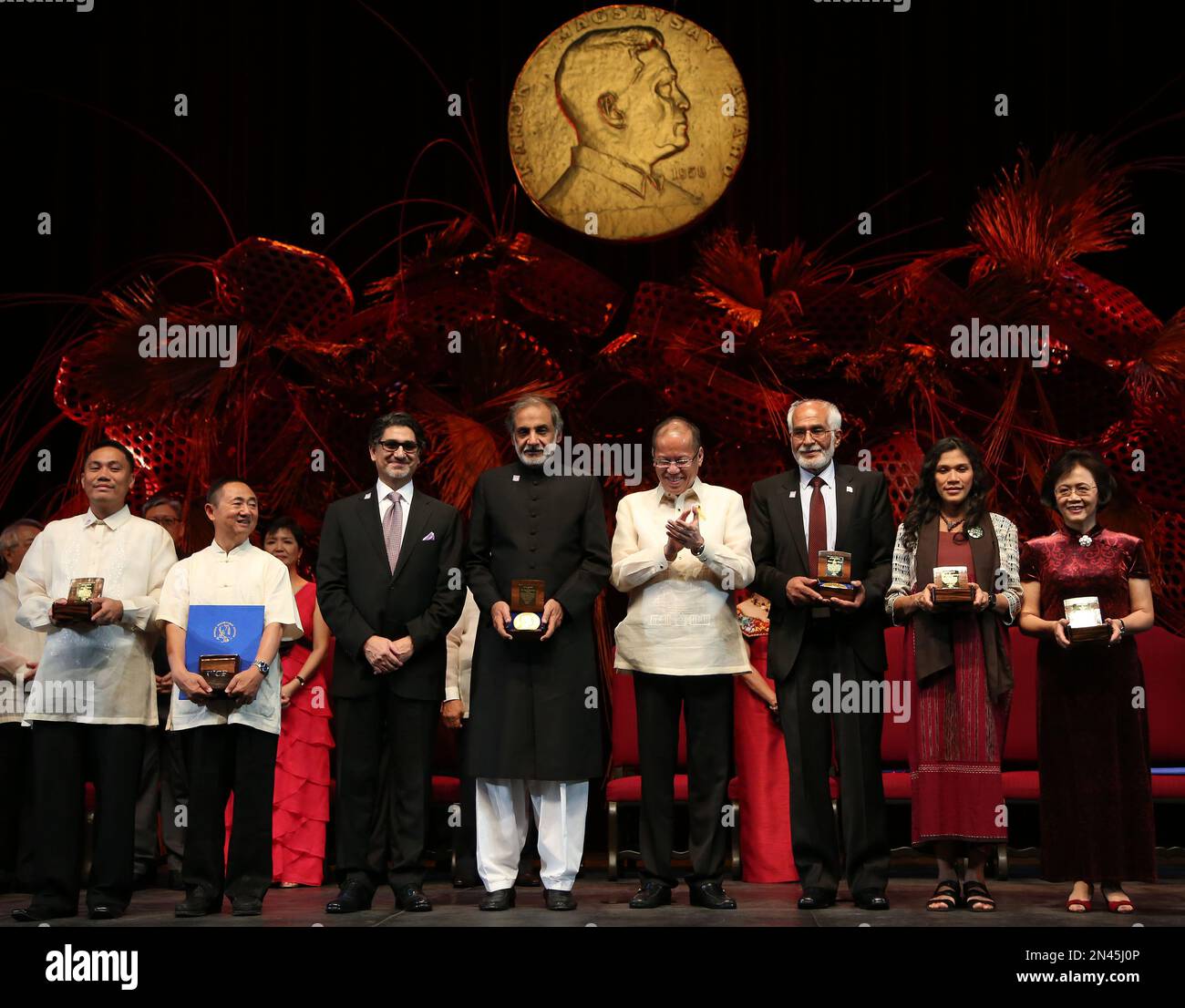 Philippine President Benigno Aquino III, 4th from right, applauds 2014 ...