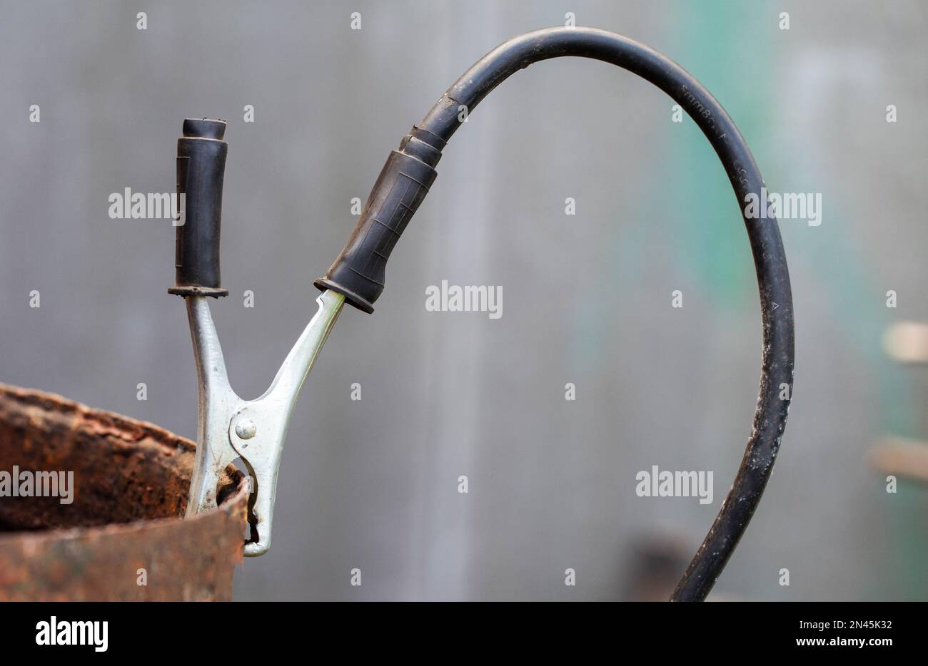 Welding terminal clamp in the welding cable for earth. Close-up ...