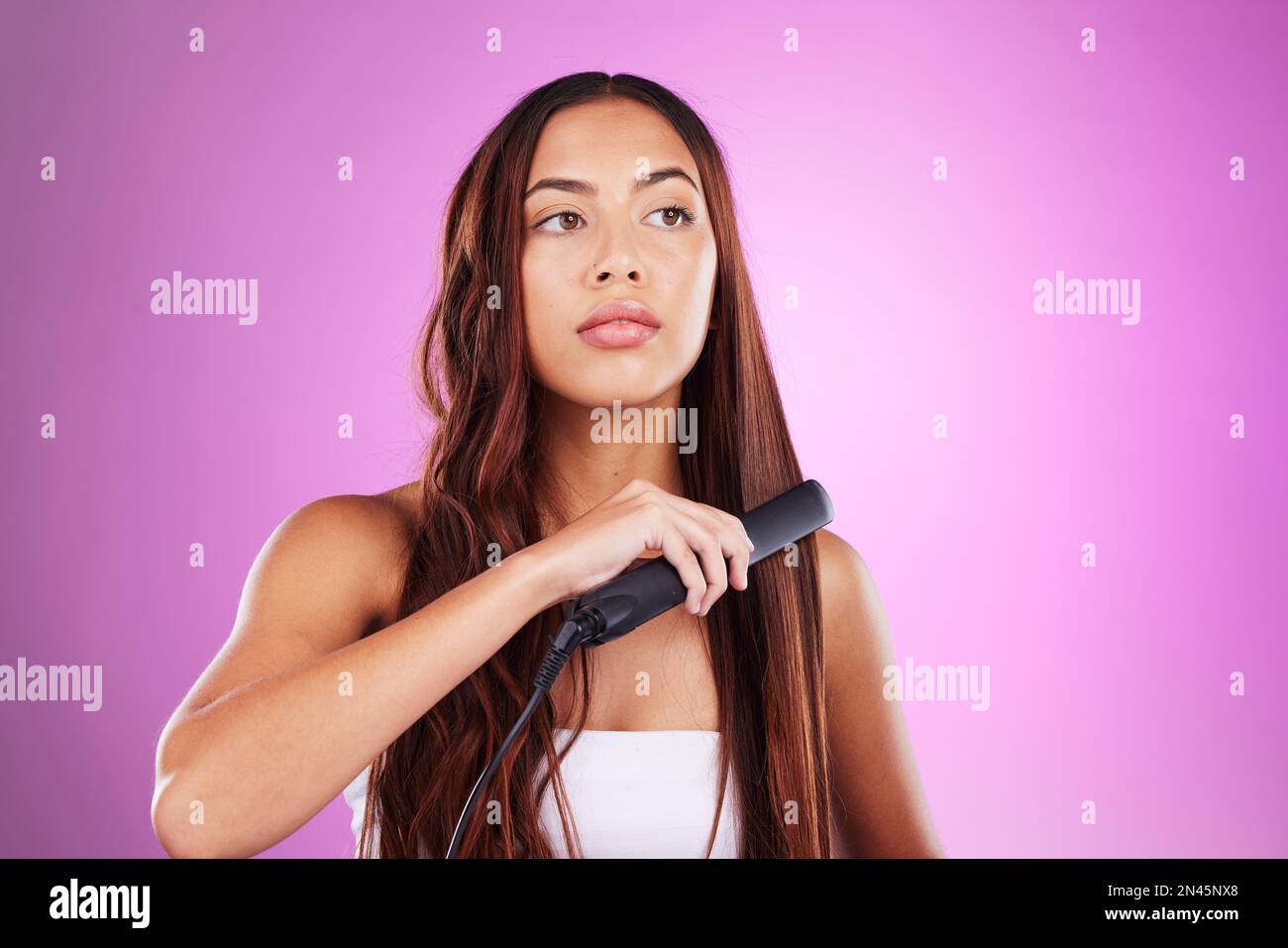 Hair, flat iron and face of girl on purple background for wellness ...