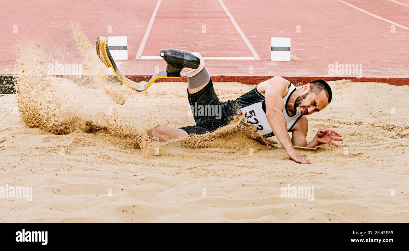 disabled athlete landing sand in long jump Stock Photo - Alamy