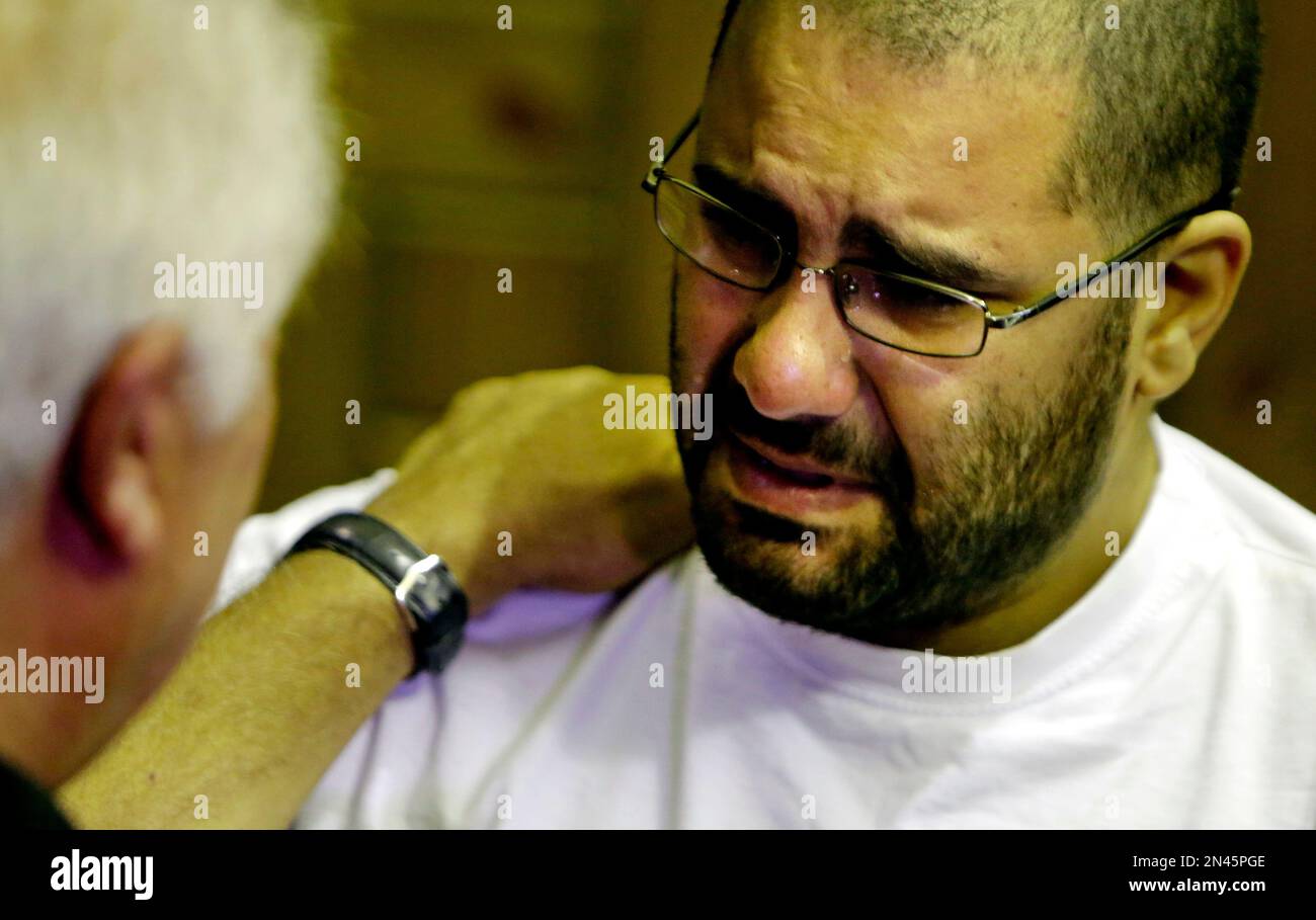 Prominent Egyptian blogger Alaa Abdel-Fattah, grieves as he receives ...