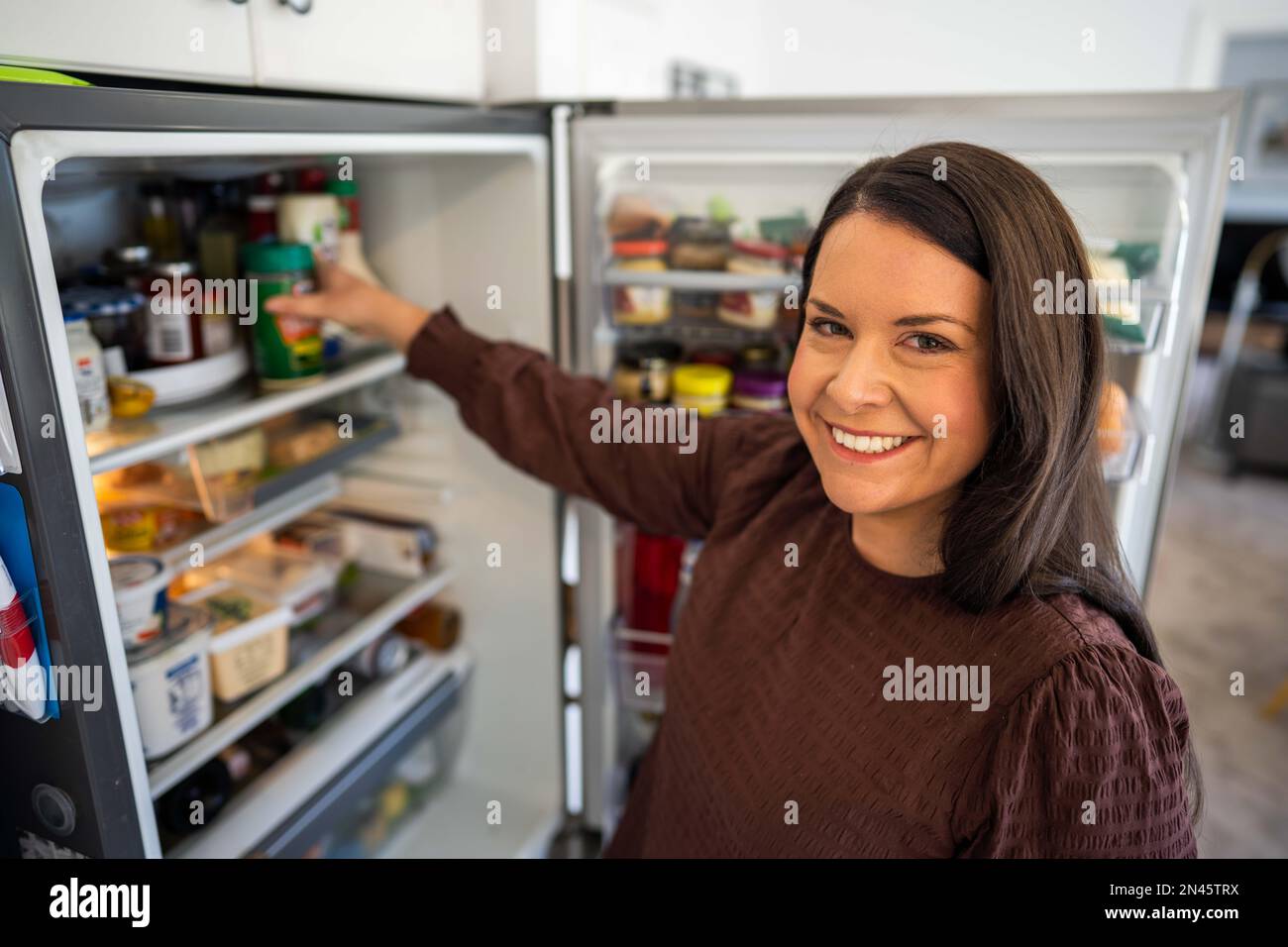 Getting food out of the fridge. Beer in the fridge. Fridge full of food ...
