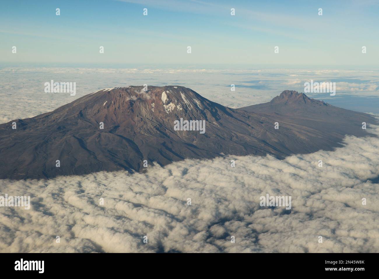 Mount Kilimanjaro with snow on top from above in Tanzania Stock Photo ...