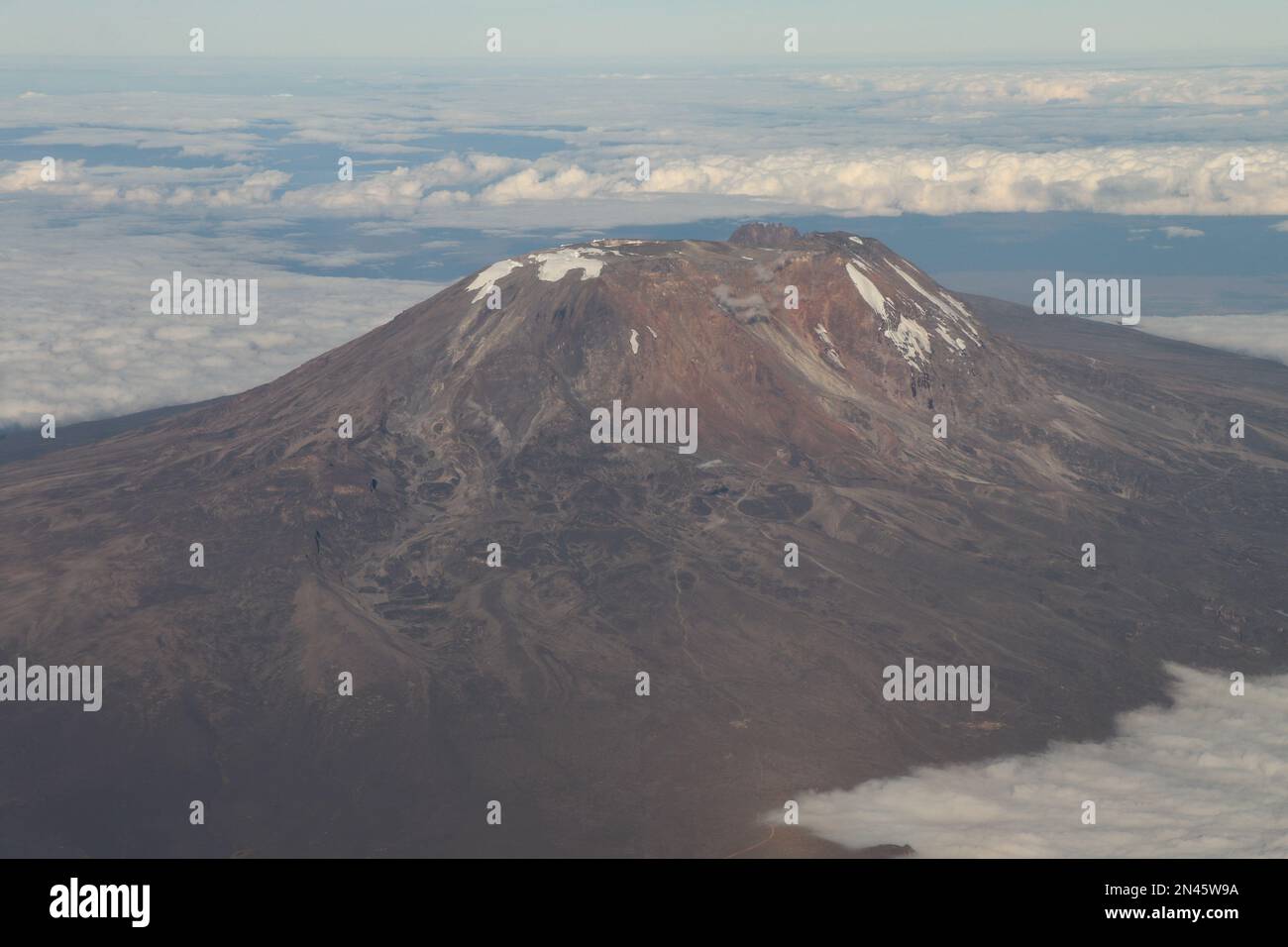 Mount Kilimanjaro with snow on top from above in Tanzania Stock Photo ...