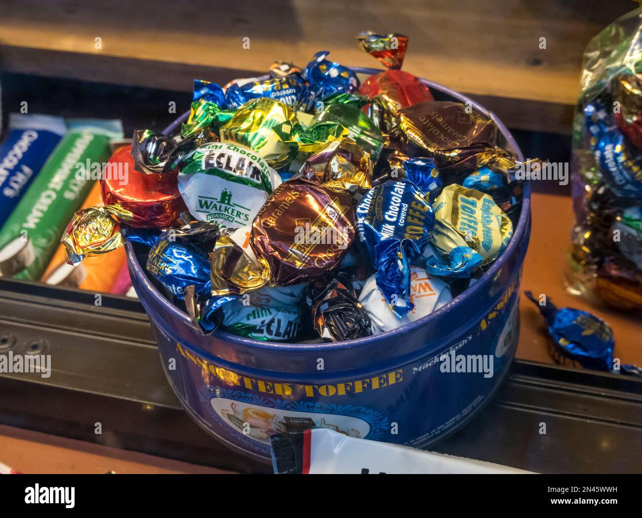 Tin of toffees in sweet shop window Stock Photo - Alamy