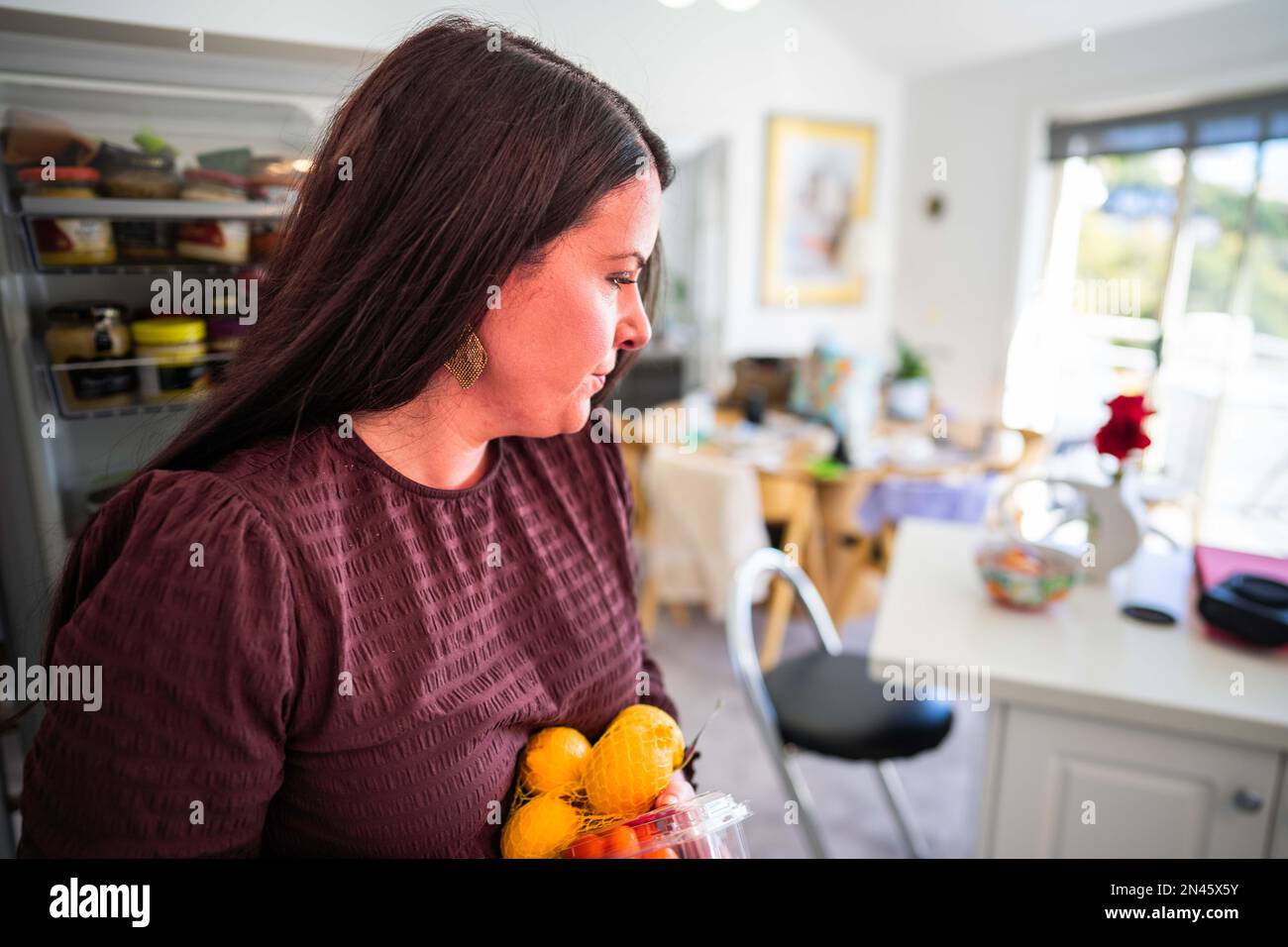 Person getting food out fridge hi-res stock photography and images - Alamy