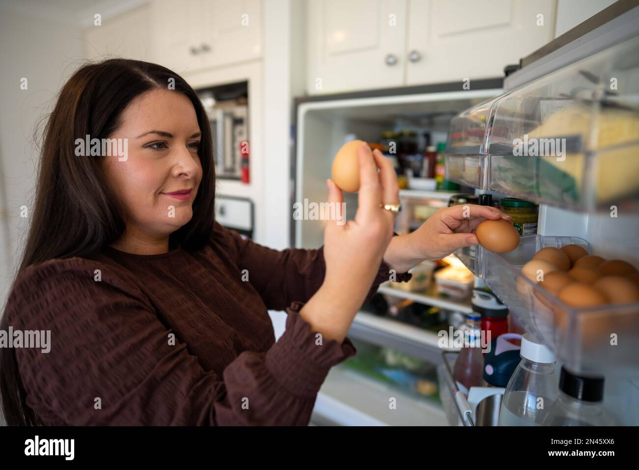 Female food containers freezer hi-res stock photography and images - Alamy