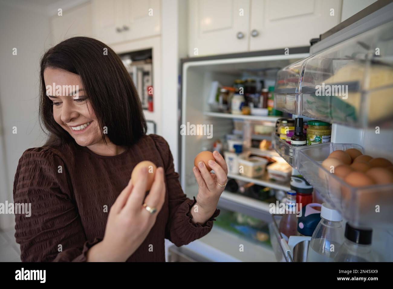 Getting food out of the fridge. Beer in the fridge. Fridge full of food ...