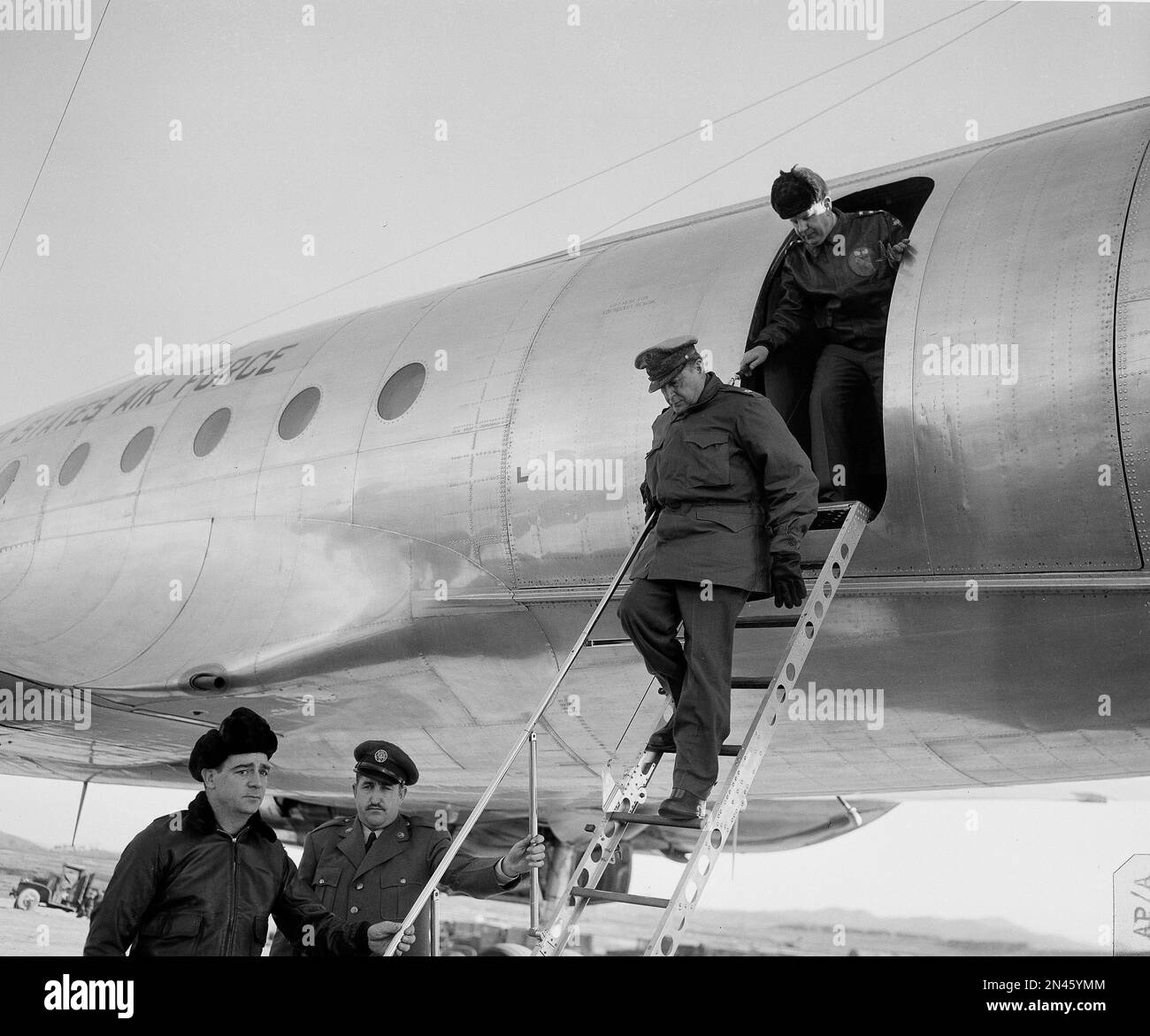 General Douglas MacArthur descends the plane ramp on his arrival in ...