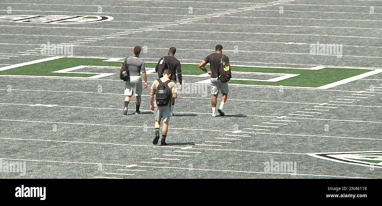 In this photo taken on Aug. 15, 2014, Eastern Michigan players walk ...