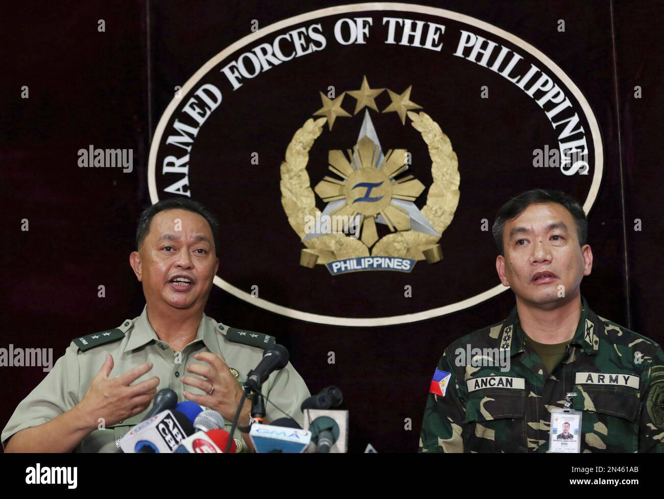 Philippine Military Spokesman Maj. Gen. Domingo Tutaan, left, answers ...