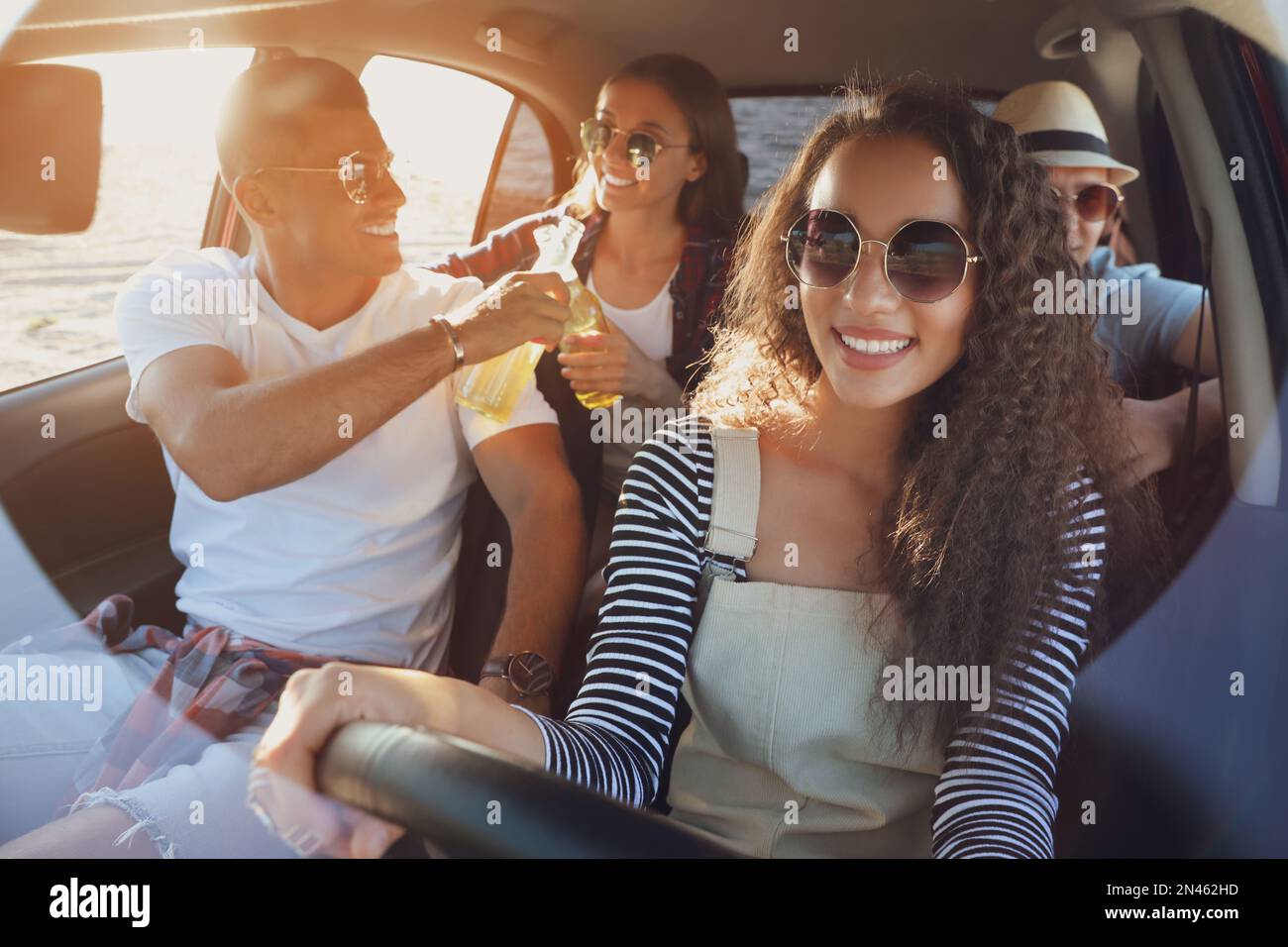 Happy friends together in car on road trip Stock Photo - Alamy