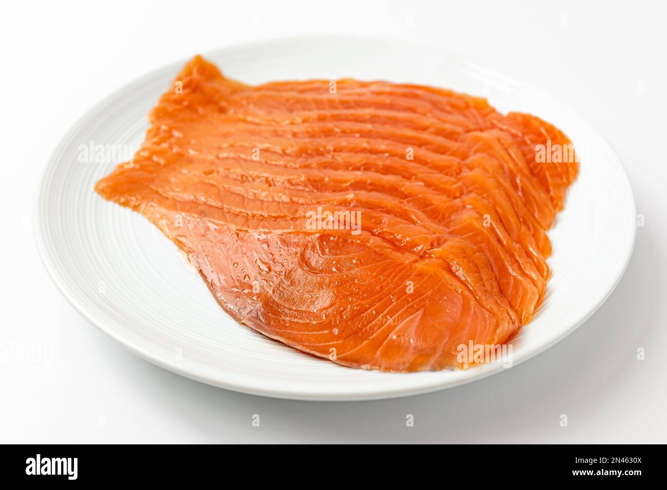 smoked fish. food made with salmon. Sliced Smoked Salmon Stock Photo ...