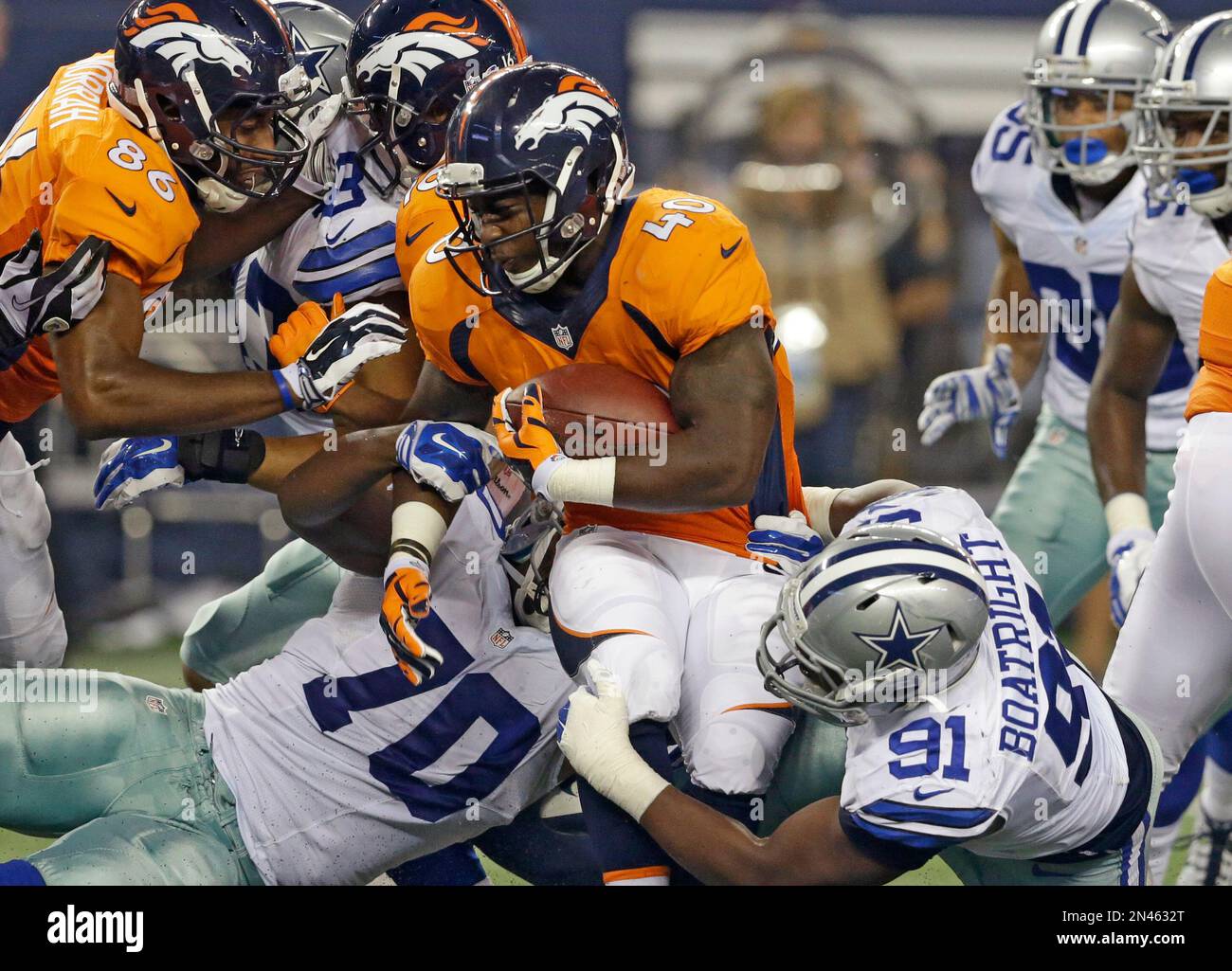 Dallas Cowboys' Dartwan Bush (70) and Kenneth Boatright (91) combine to ...