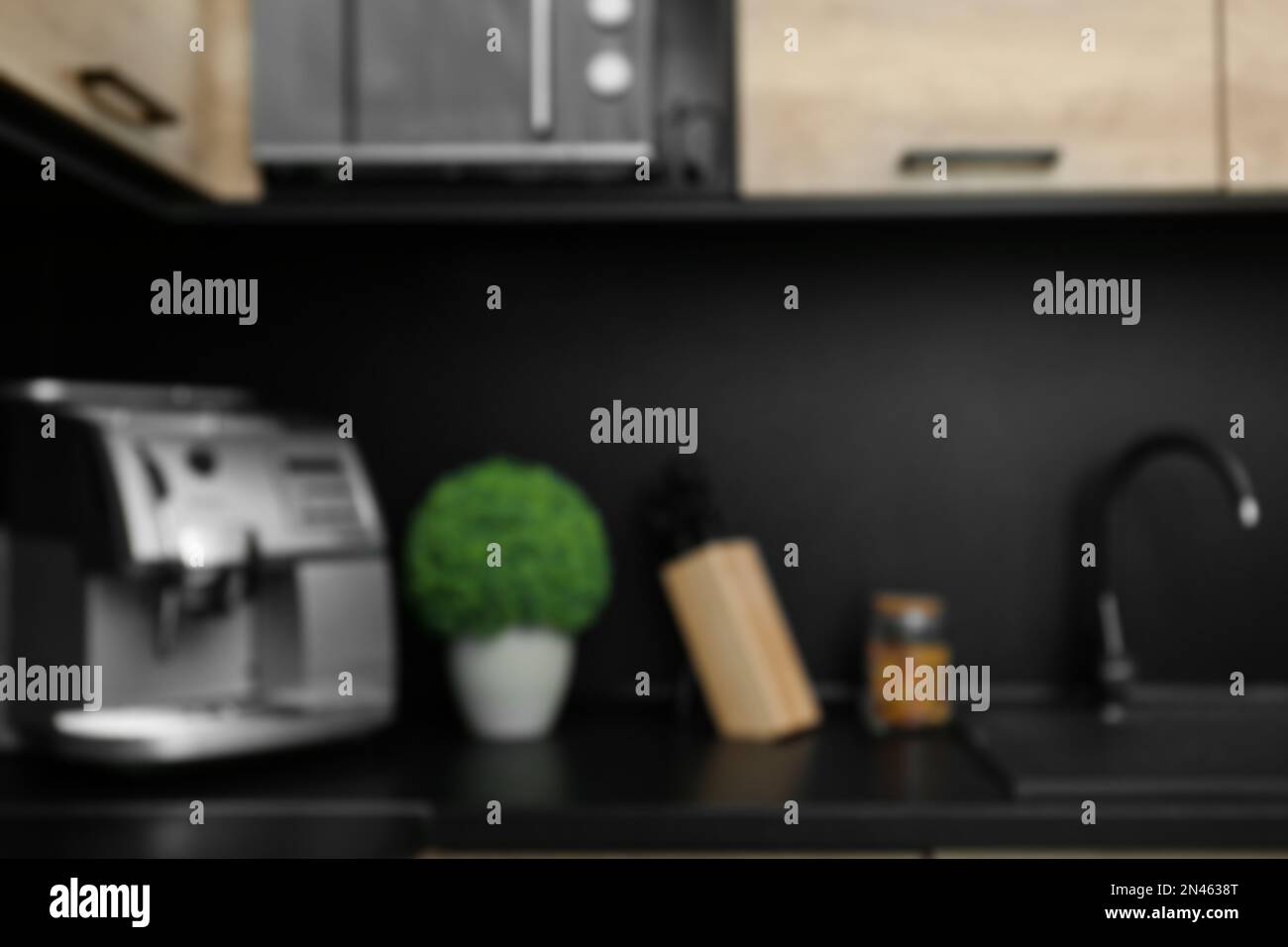 Blurred view of kitchen interior with modern furniture Stock Photo - Alamy