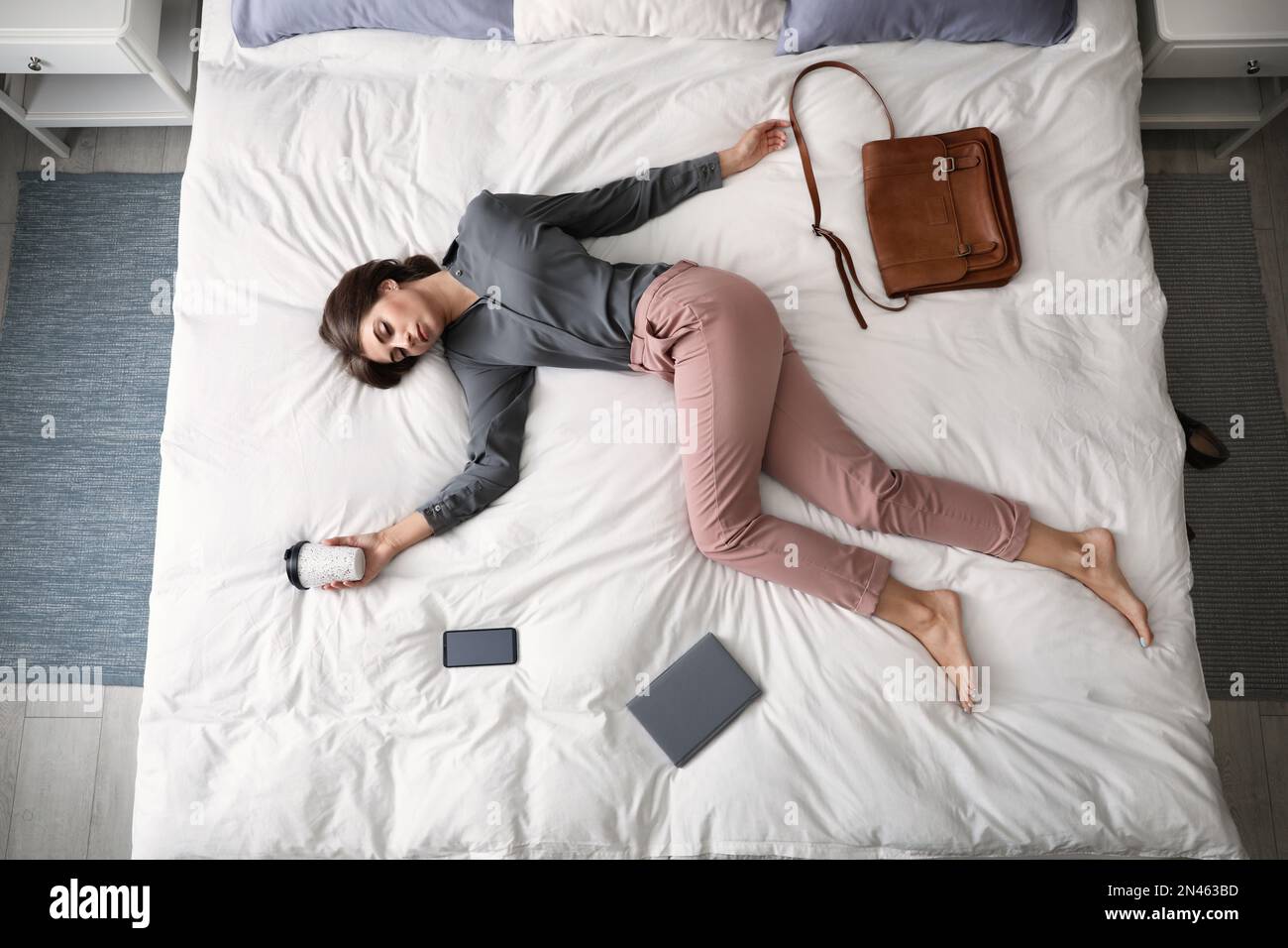 Fully dressed woman lying on bed hi-res stock photography and images ...