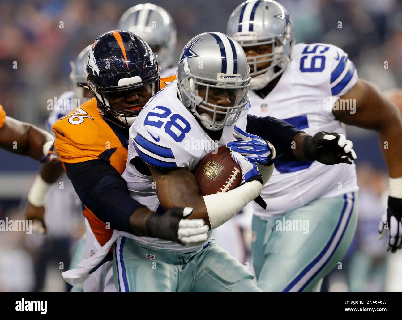 Denver Broncos defensive tackle Marvin Austin (76) wraps up Dallas ...