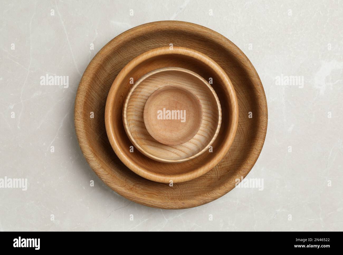 Wooden bowls on grey table, top view. Cooking utensils Stock Photo - Alamy