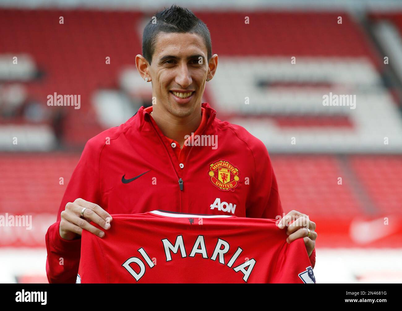 Manchester United's new player Angel Di Maria poses for photographers ...