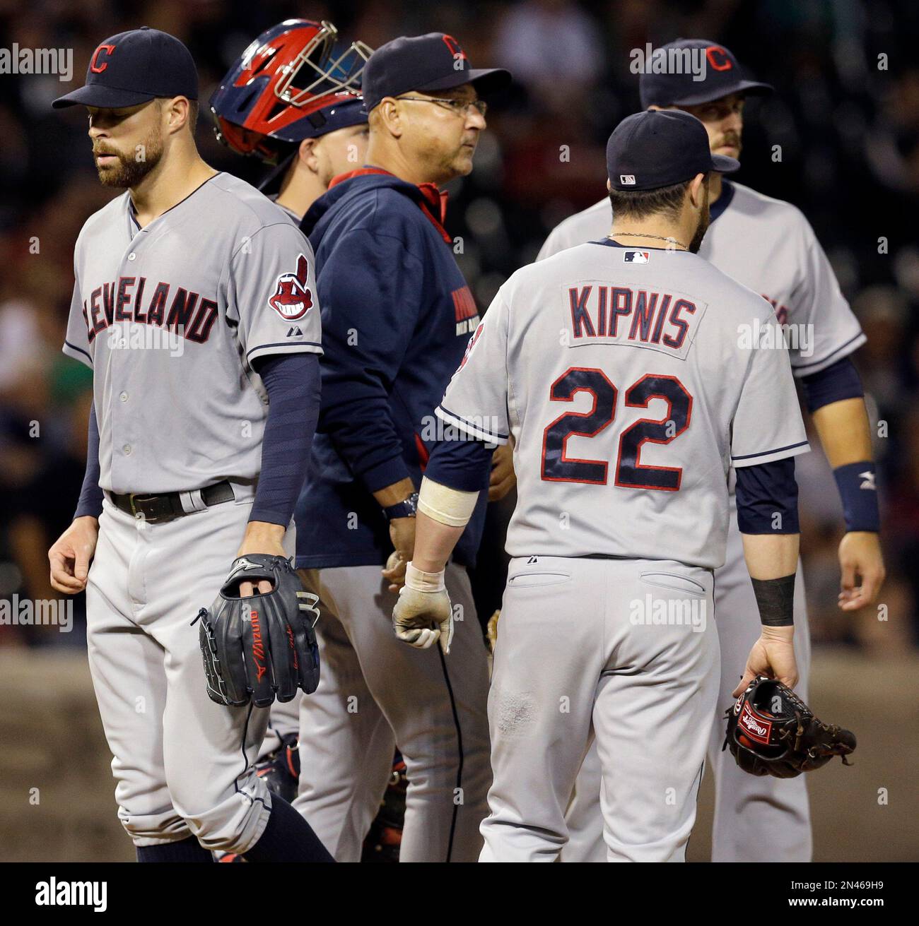 Cleveland Indians starter Corey Kluber, left, is taken out of the game ...